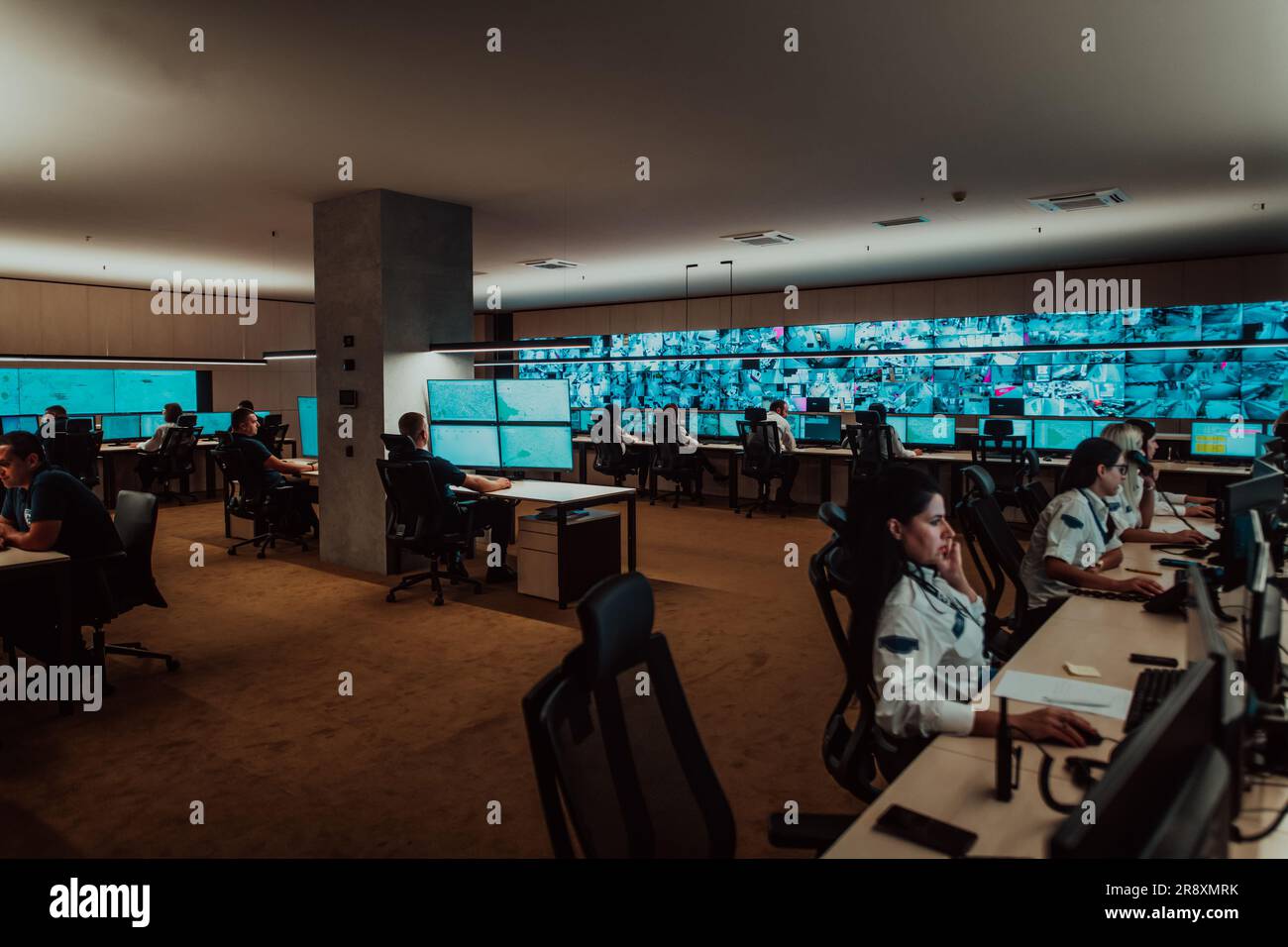 Group of Security data center operators working in a CCTV monitoring ...