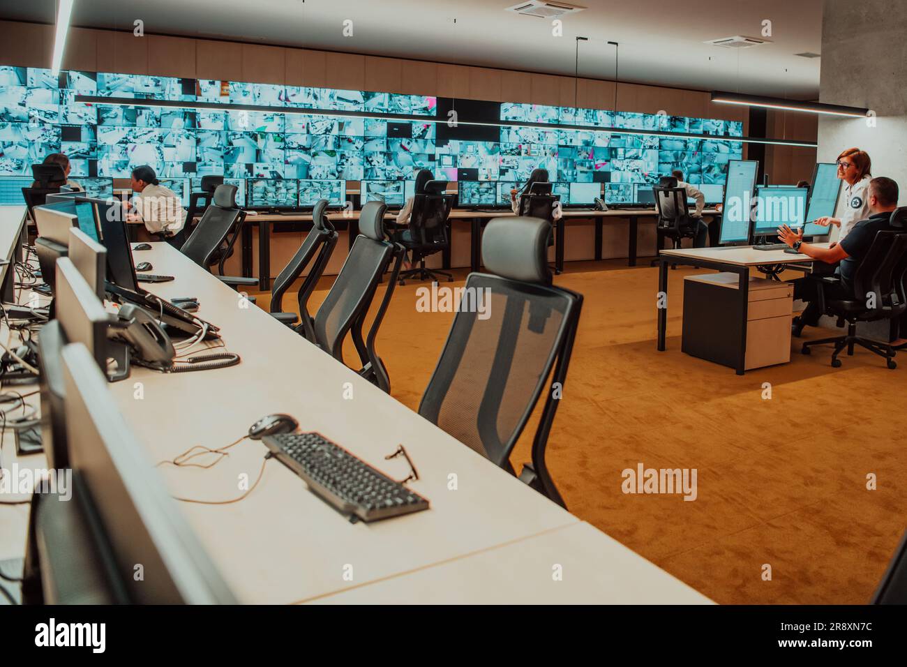 Group of Security data center operators working in a CCTV monitoring ...