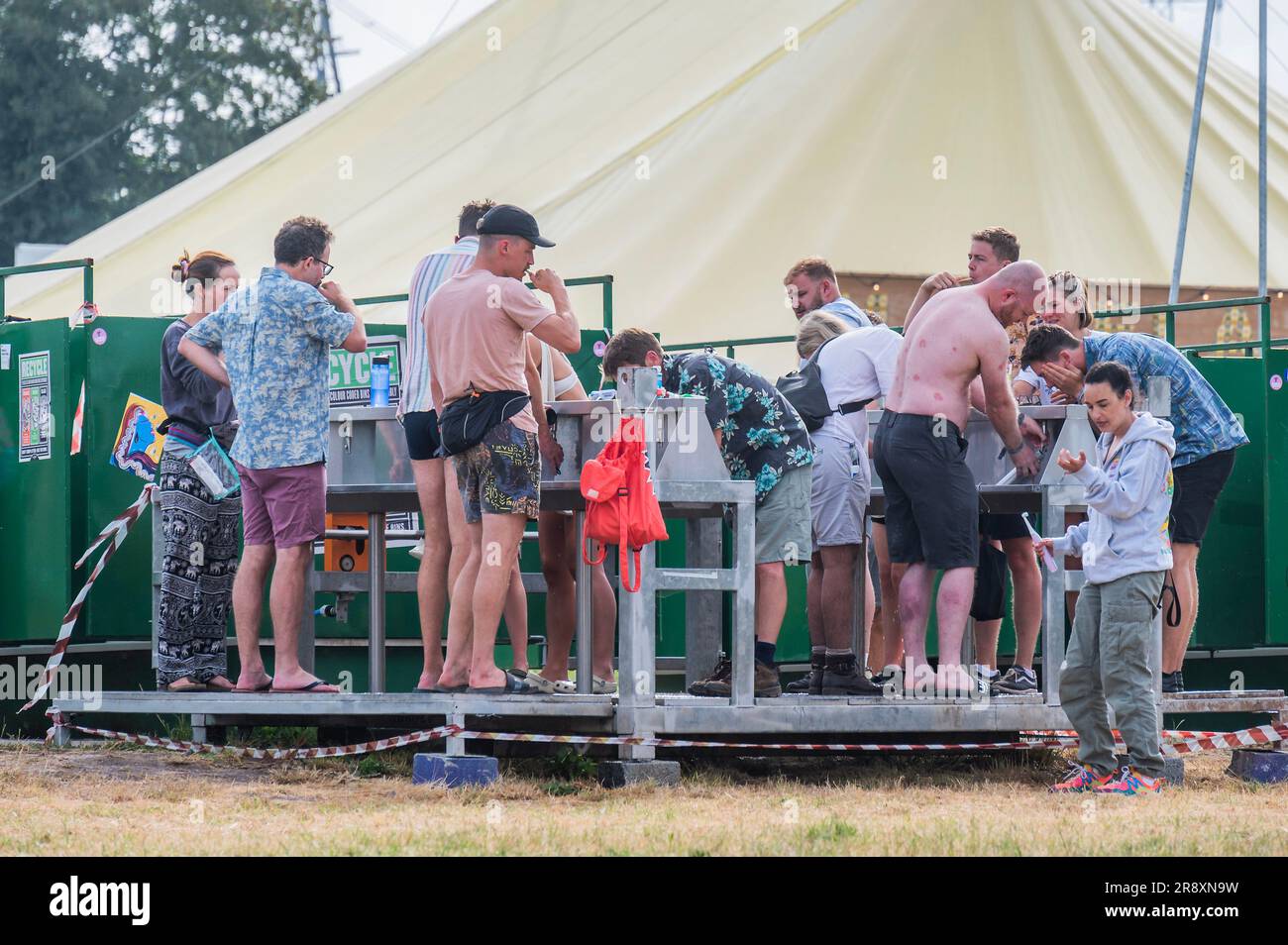 Glastonbury, UK. 23rd June, 2023. Morning washing ond othe ablutions ...