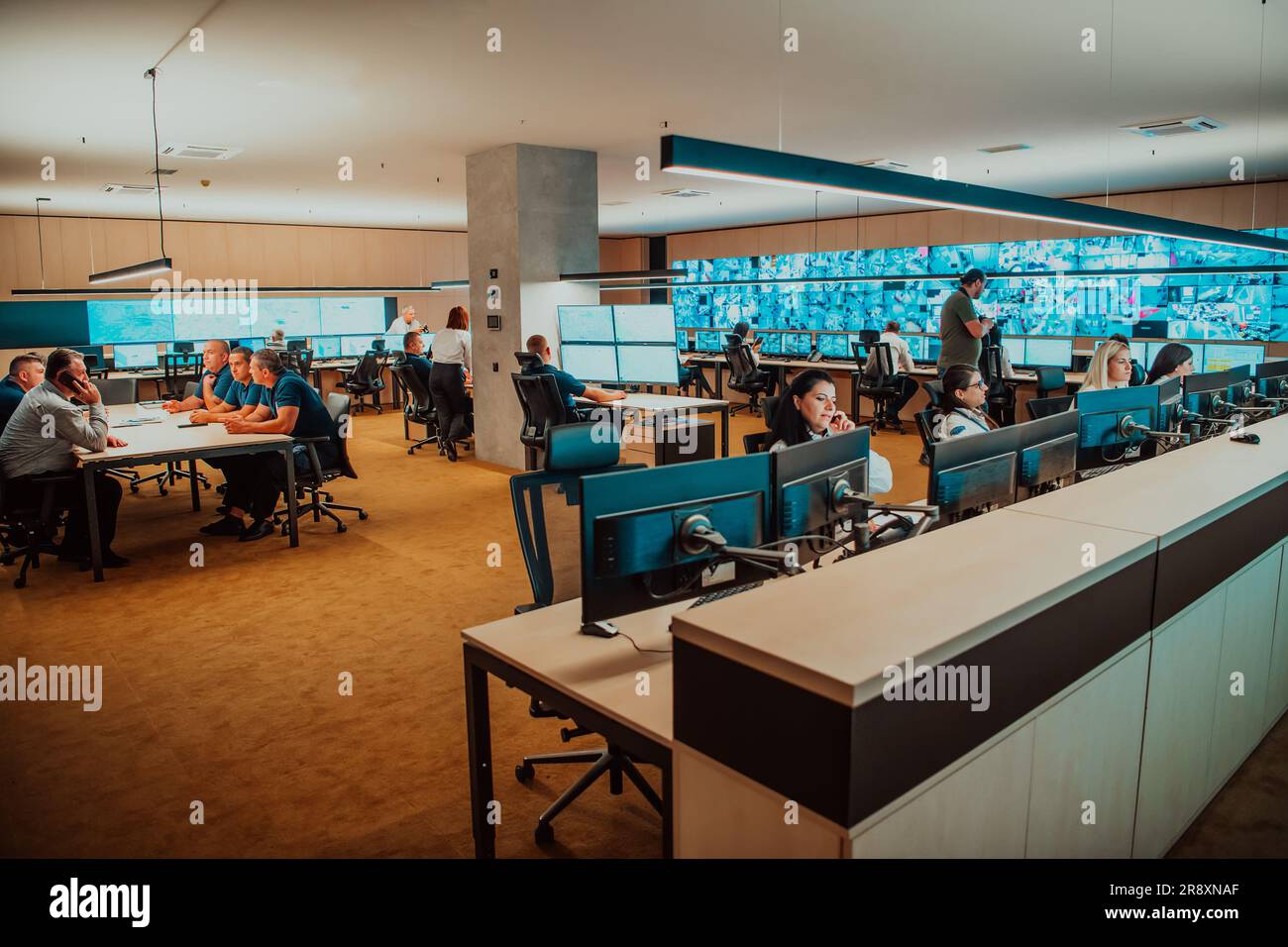Group of Security data center operators working in a CCTV monitoring ...