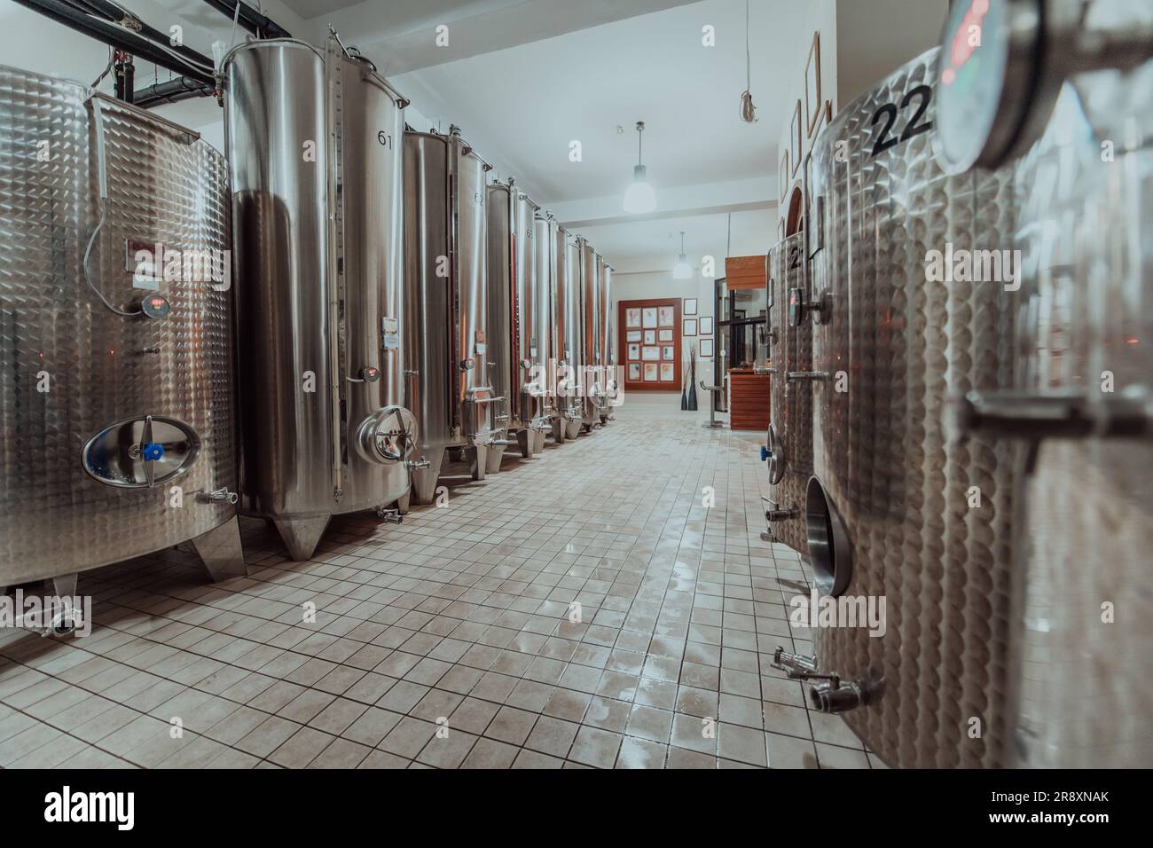 Modern wine distillery and brewery with brew kettles pipes and ...