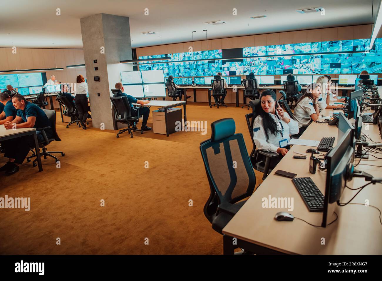 Group of Security data center operators working in a CCTV monitoring ...