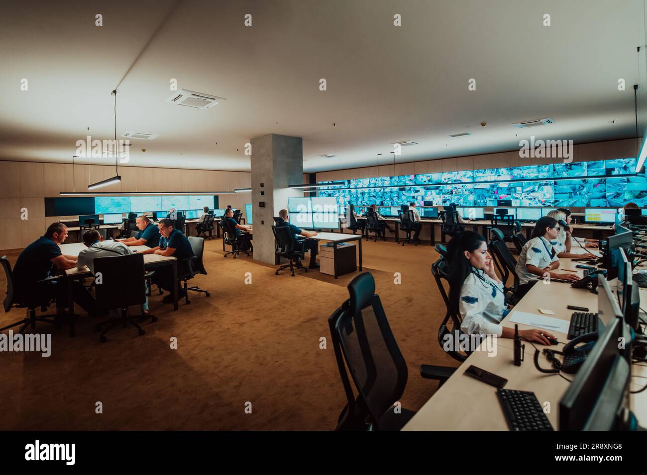 Group of Security data center operators working in a CCTV monitoring ...