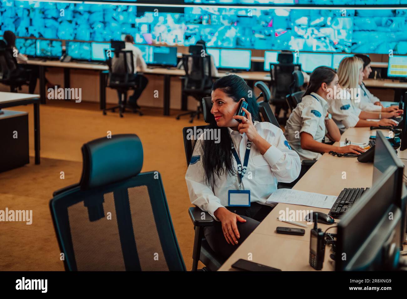 Group of Security data center operators working in a CCTV monitoring ...