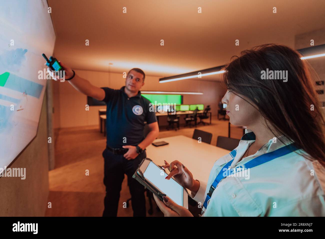 Group of security operators working in a data system control room Technical Operators Working at ...