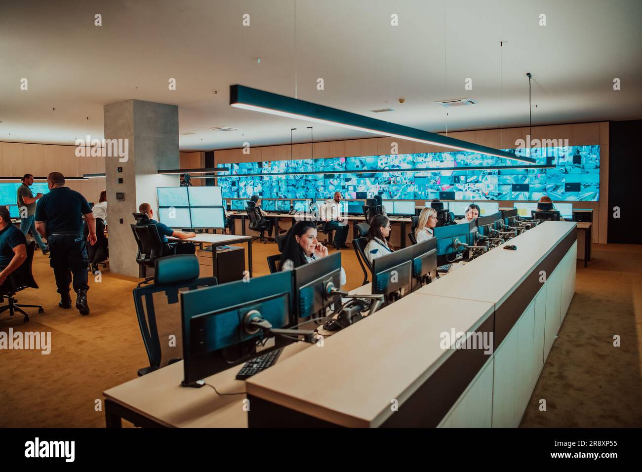 Group of Security data center operators working in a CCTV monitoring ...