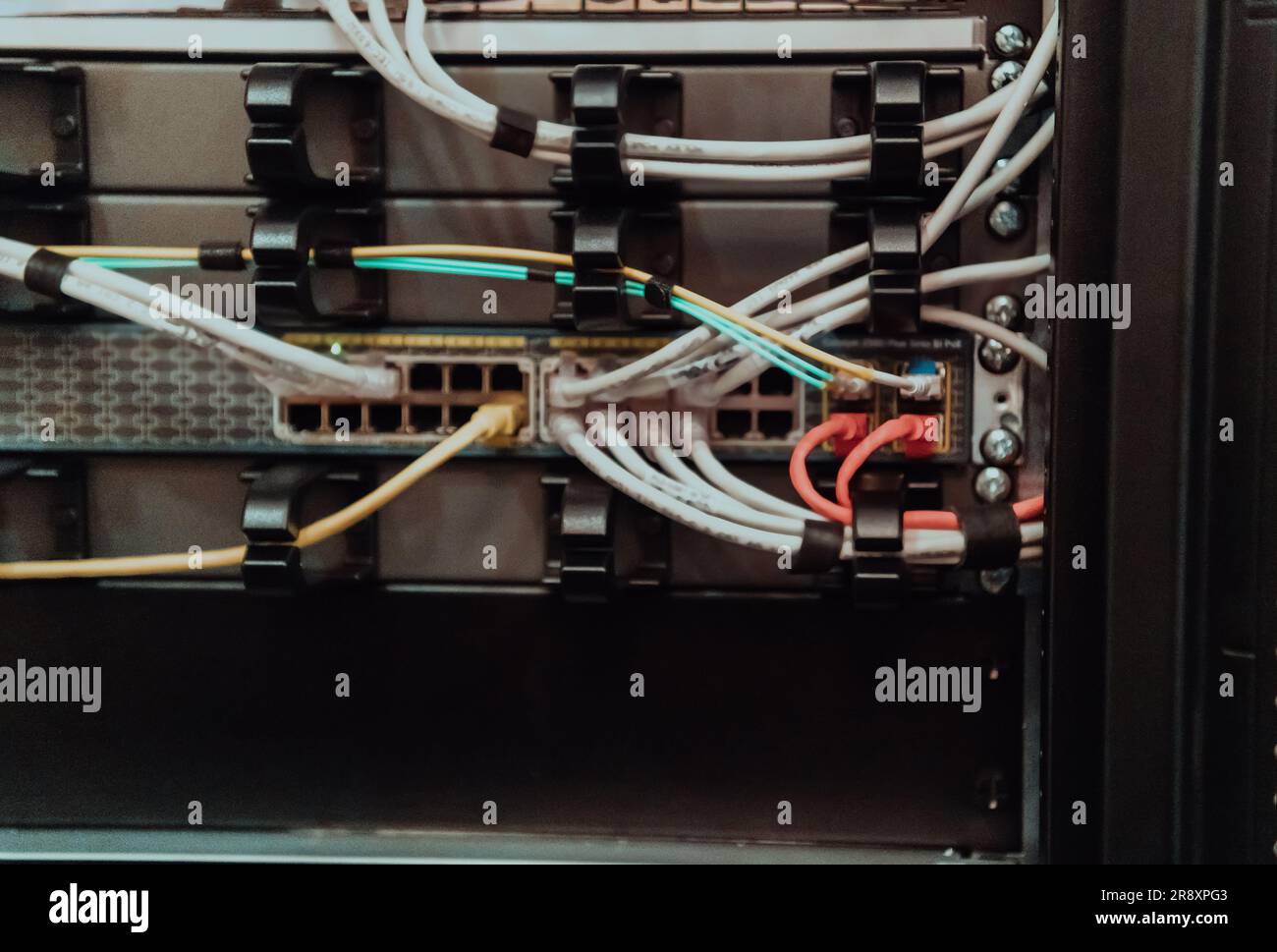 Close up of technician setting up network in server room Stock Photo - Alamy