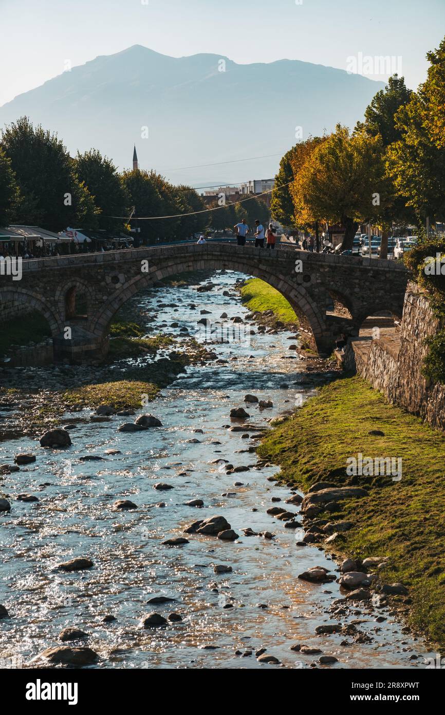 a stone bridge over the Lumbardhi i Prizrenit river in the city of ...