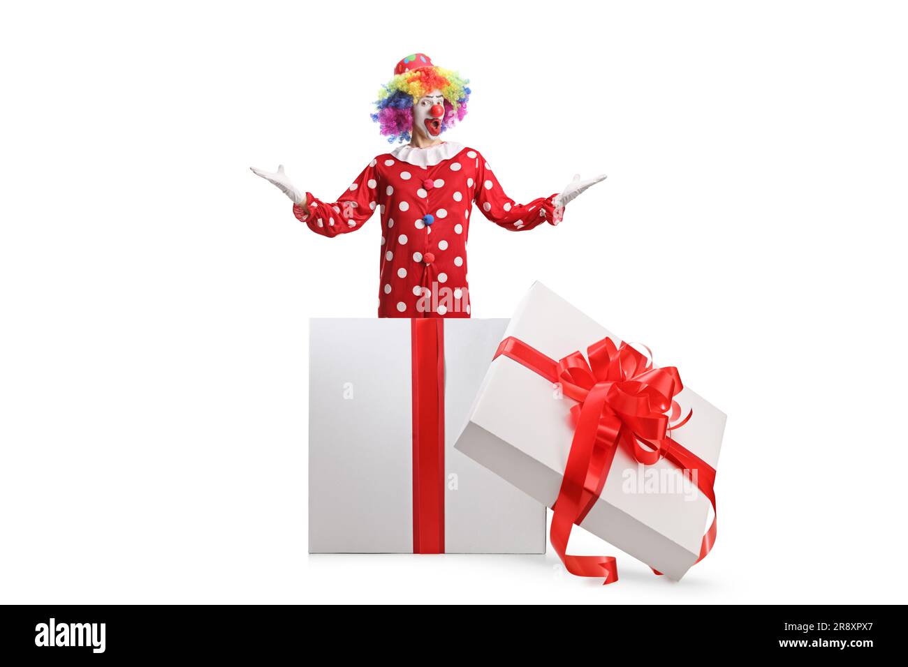 Clown standing inside a gift box isolated on white background Stock ...