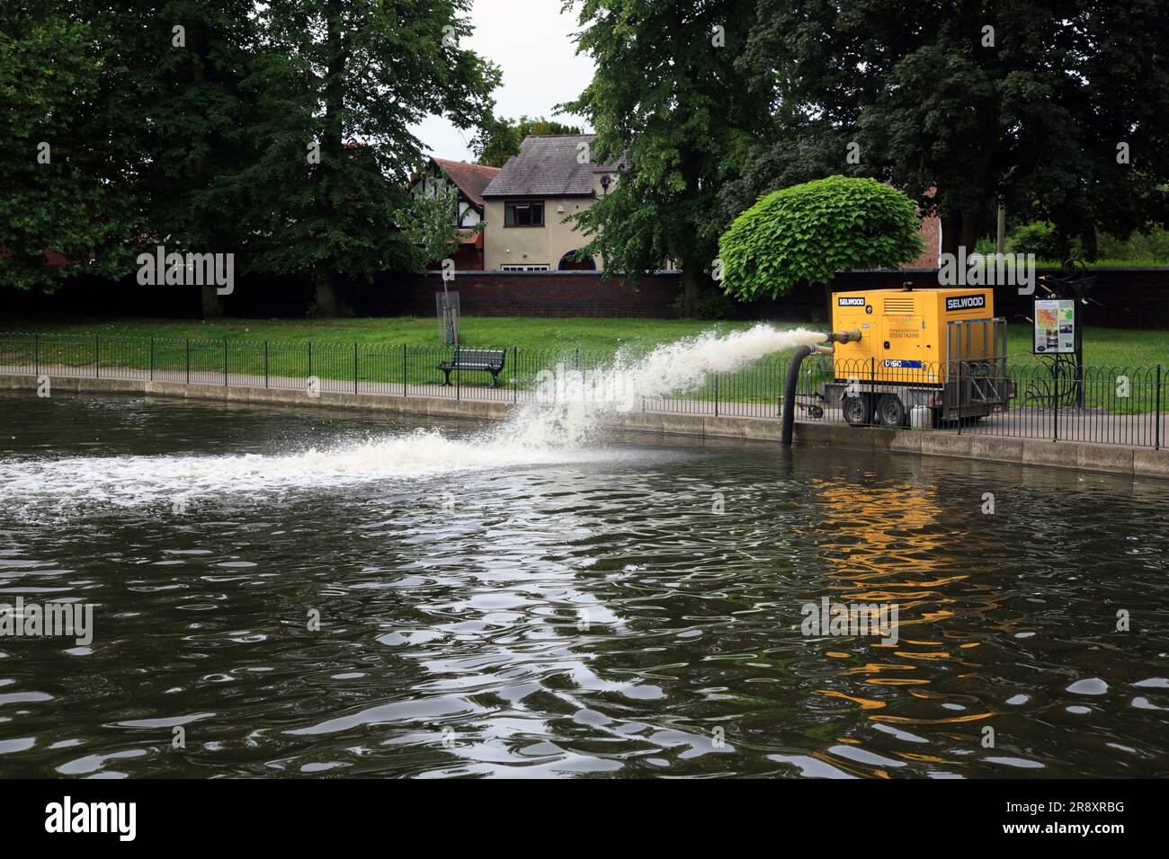 Pump aerating water in an ornamental pool during hot weather in 2023 ...