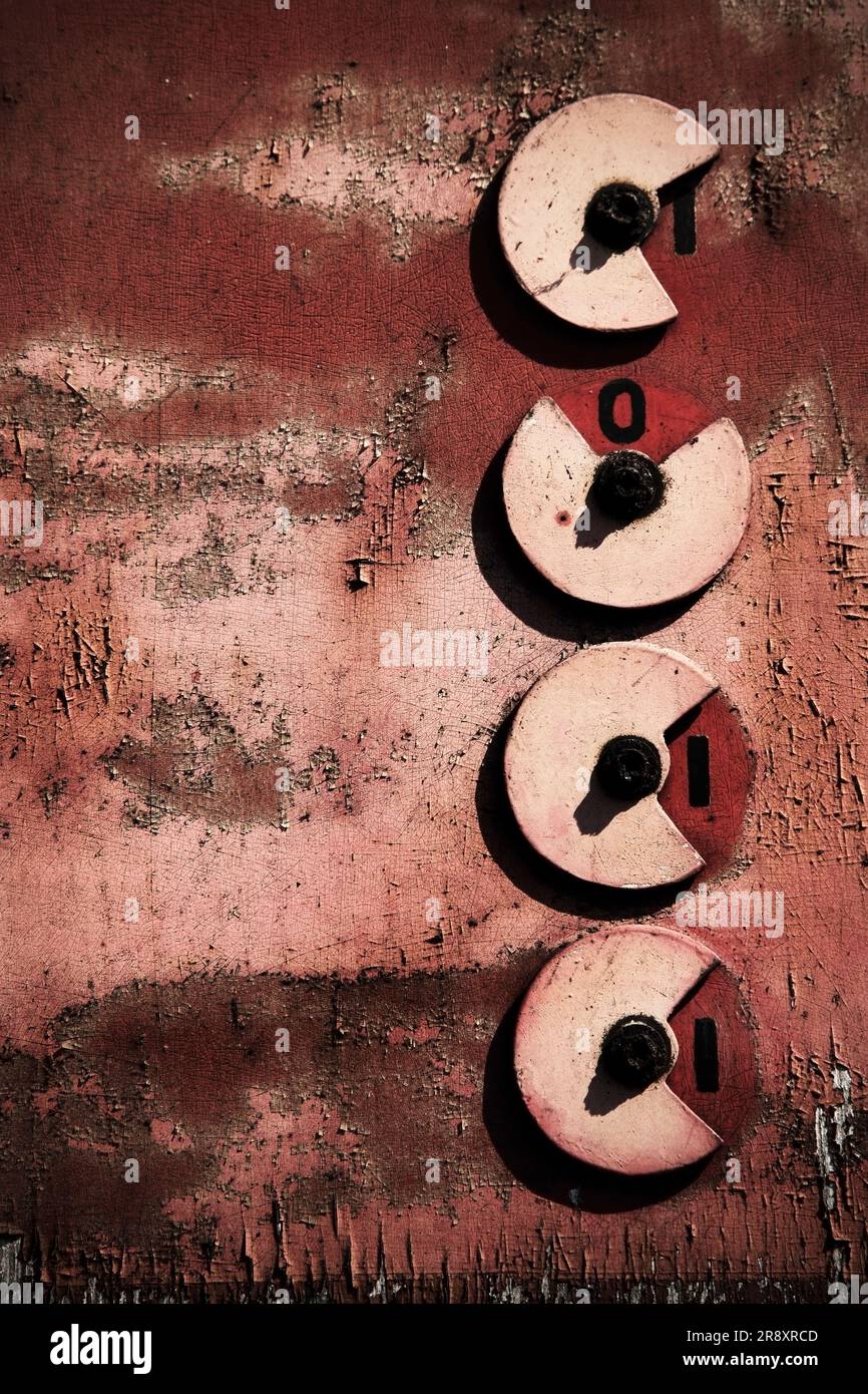 Rotating indicators on old red sign Stock Photo - Alamy