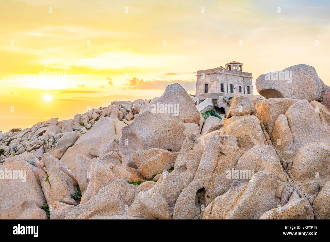 The old lighthouse at sunset on the Capo Testa peninsula, Sardinia ...