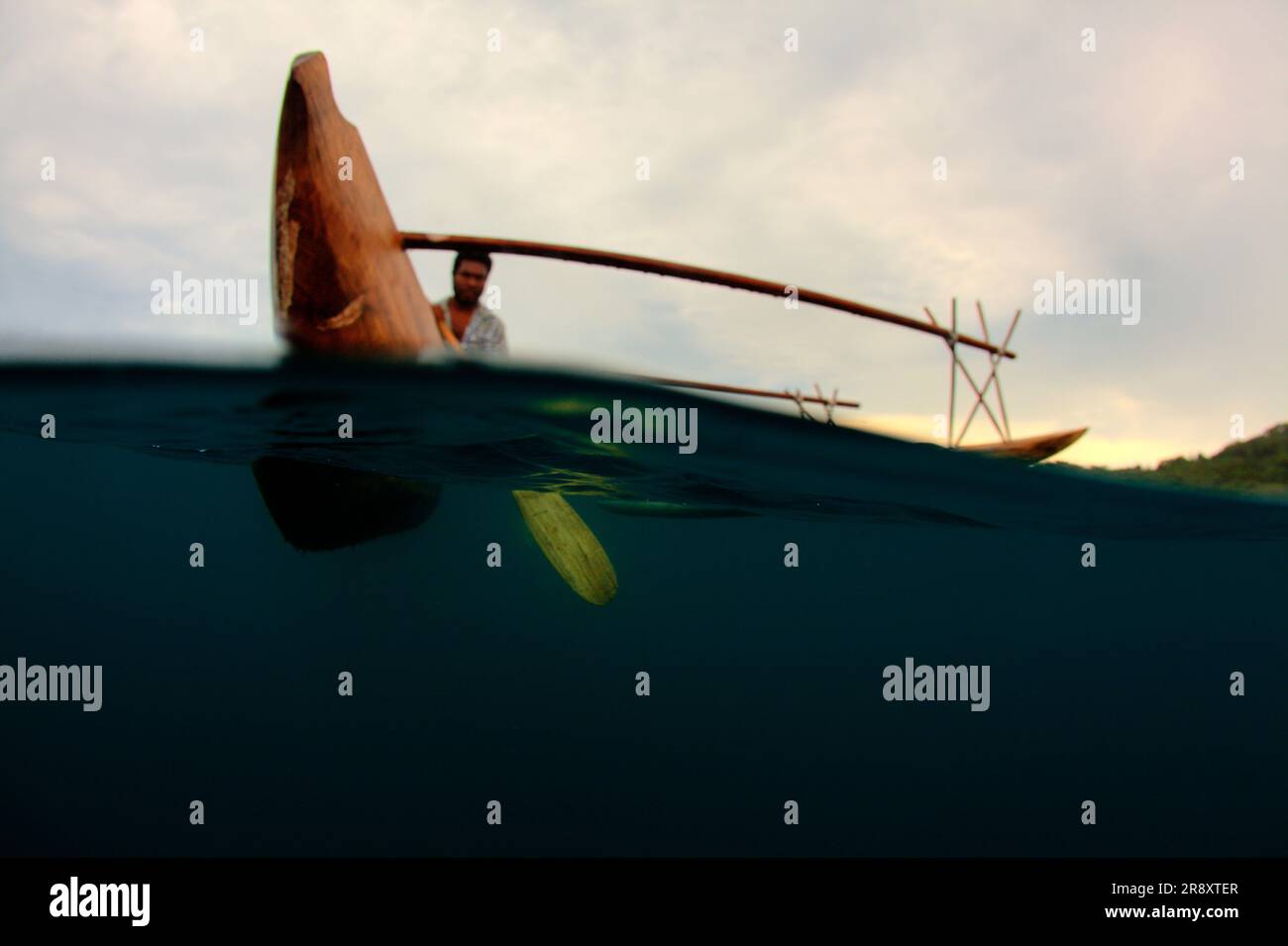 Native in outrigger canoe hi-res stock photography and images - Alamy
