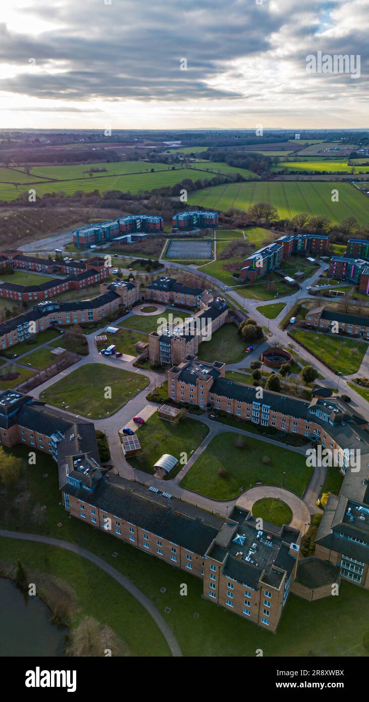 An aerial view of a suburban area showcasing a modern apartment complex ...