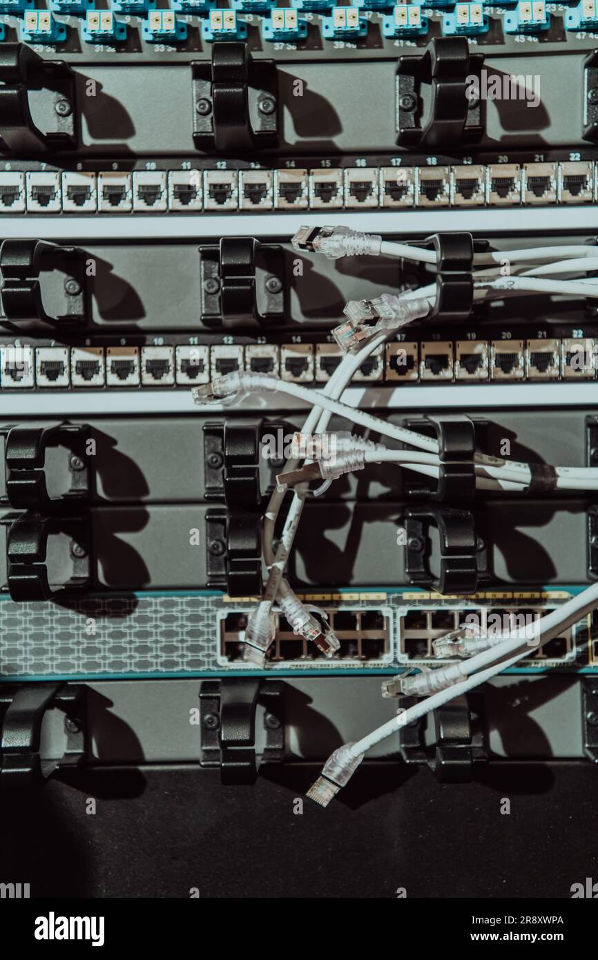 Close up of technician setting up network in server room Stock Photo ...