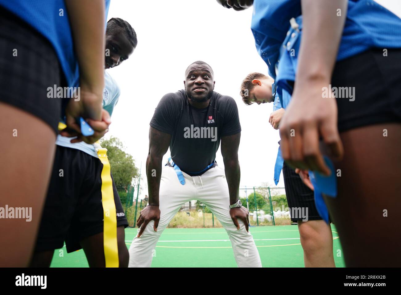 Efe Obada from the NFL team Washington Commanders interacts with ...