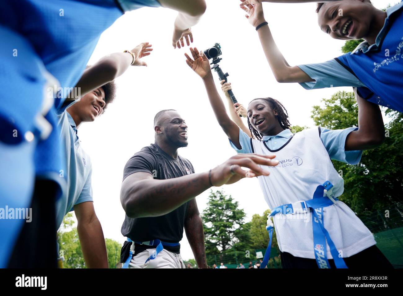 Efe Obada from the NFL team Washington Commanders interacts with ...