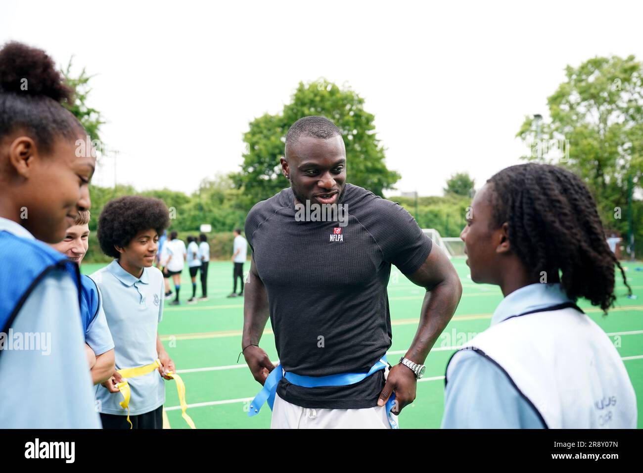 Efe Obada from the NFL team Washington Commanders interacts with ...