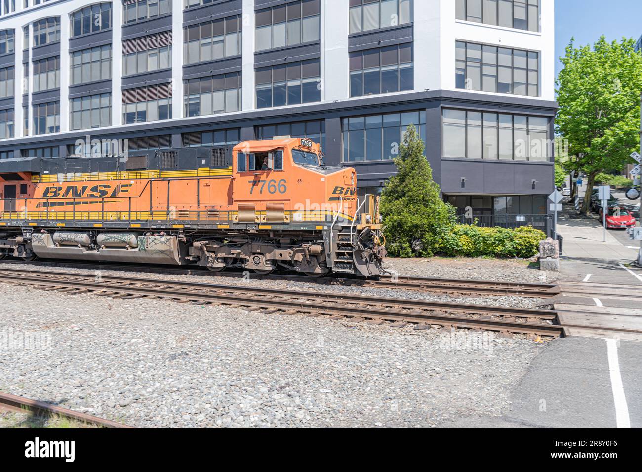 BNSF freight train passing office buildings from Alaskan Way, Seattle ...