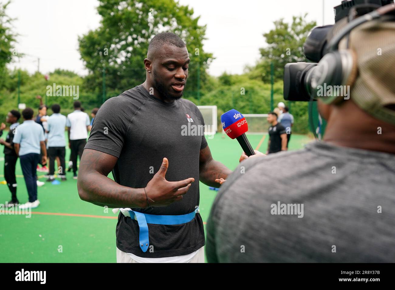 Efe Obada from the NFL team Washington Commanders does an interview ...