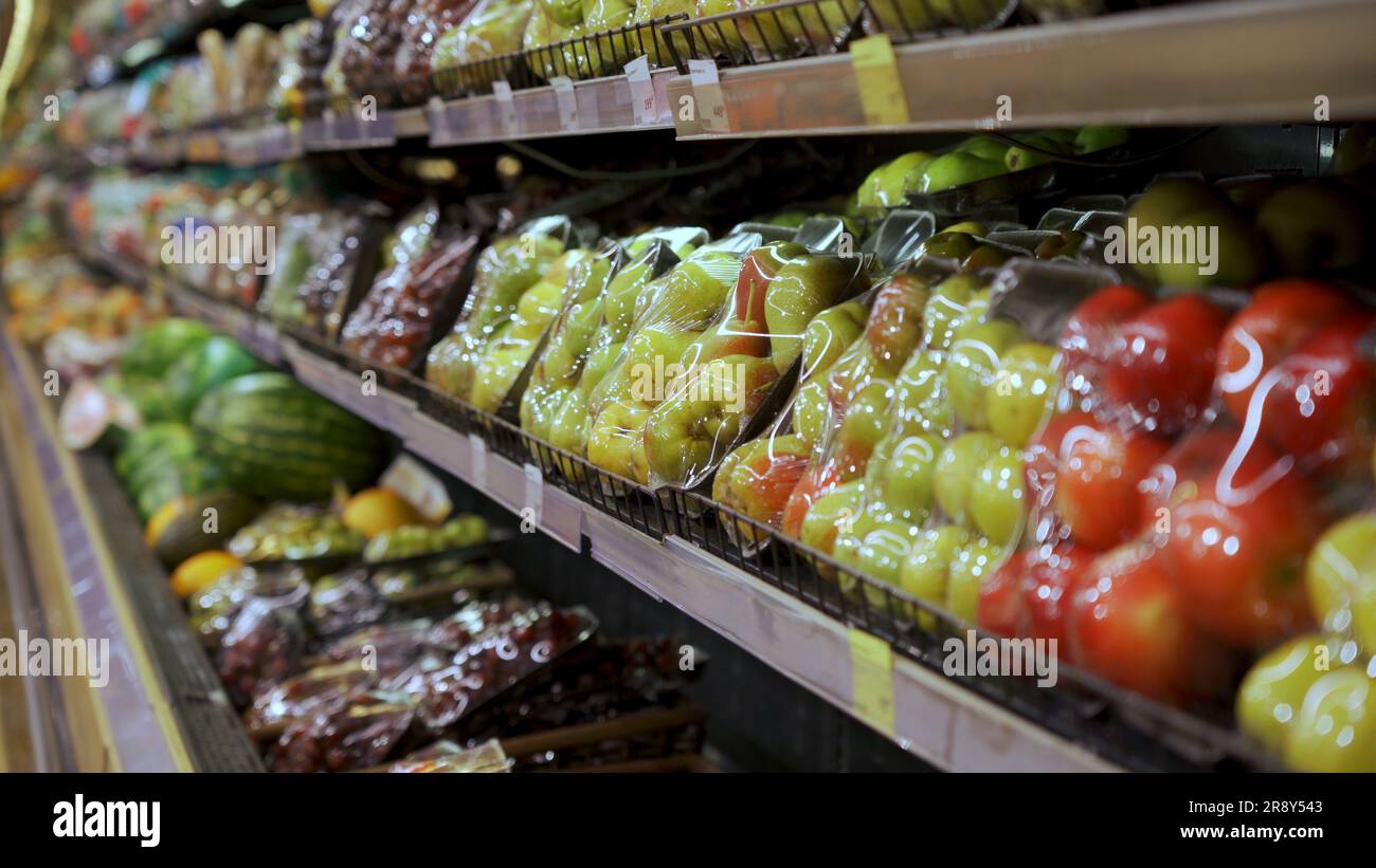 Vacuum-packed fresh fruit on the store shelf in the supermarket Stock ...