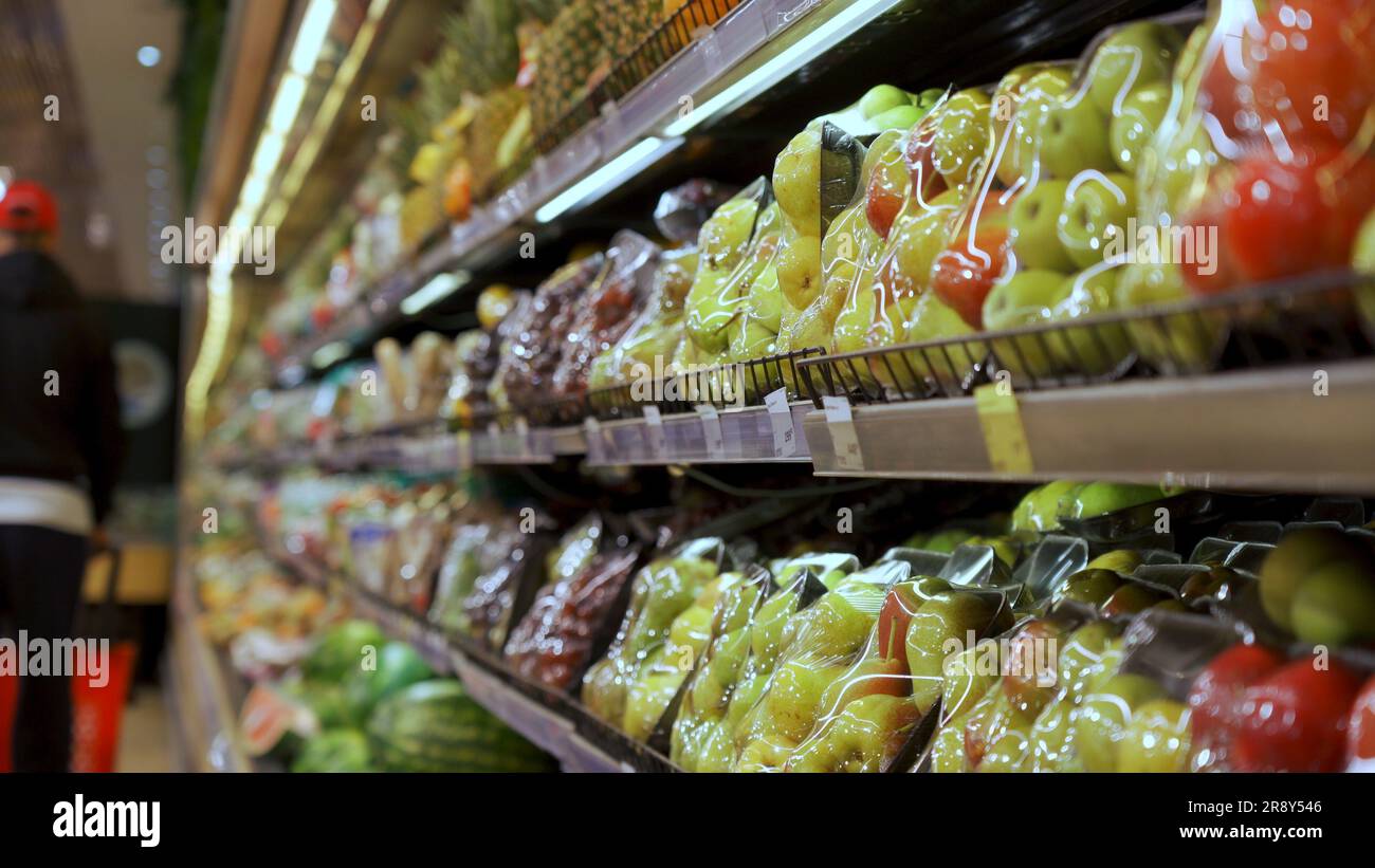 Vacuum-packed fresh fruit on the store shelf in the supermarket Stock ...
