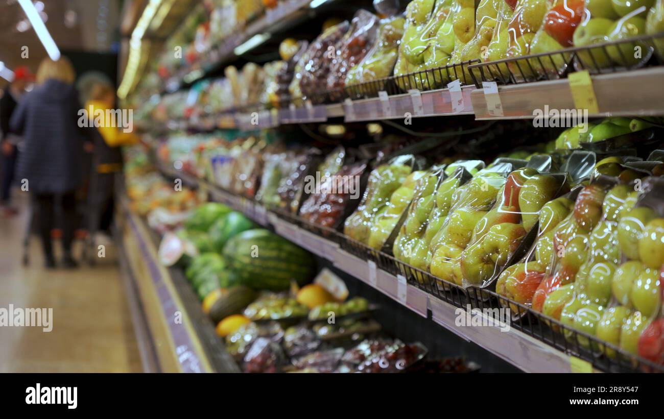Vacuum-packed fresh fruit on the store shelf in the supermarket Stock ...