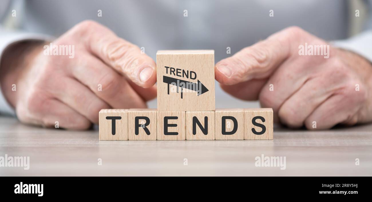 Wooden blocks with symbol of trends concept Stock Photo - Alamy