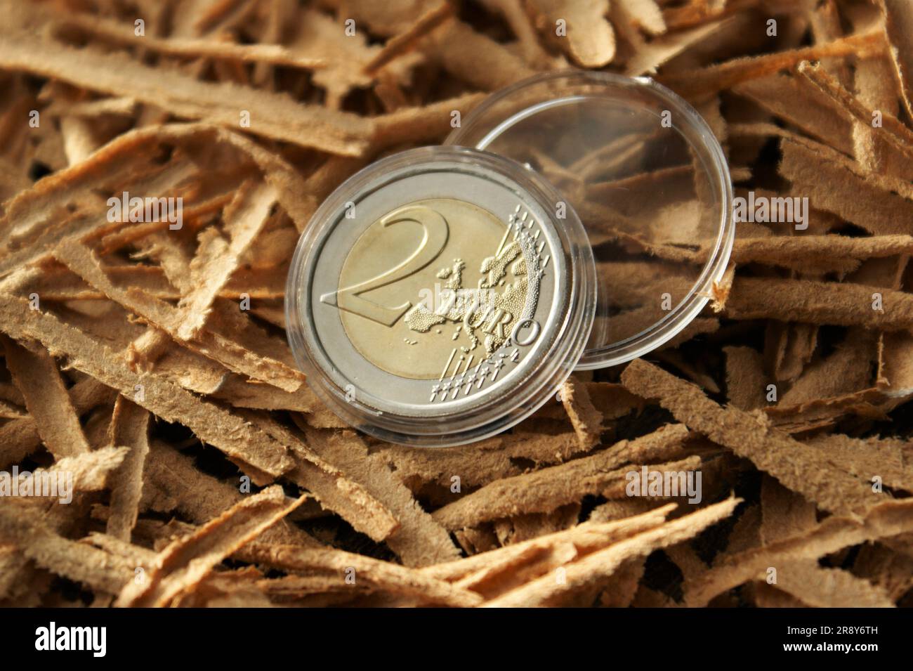 2 Euro coin in a transparent plastic capsule. Eurozone coinage and ...