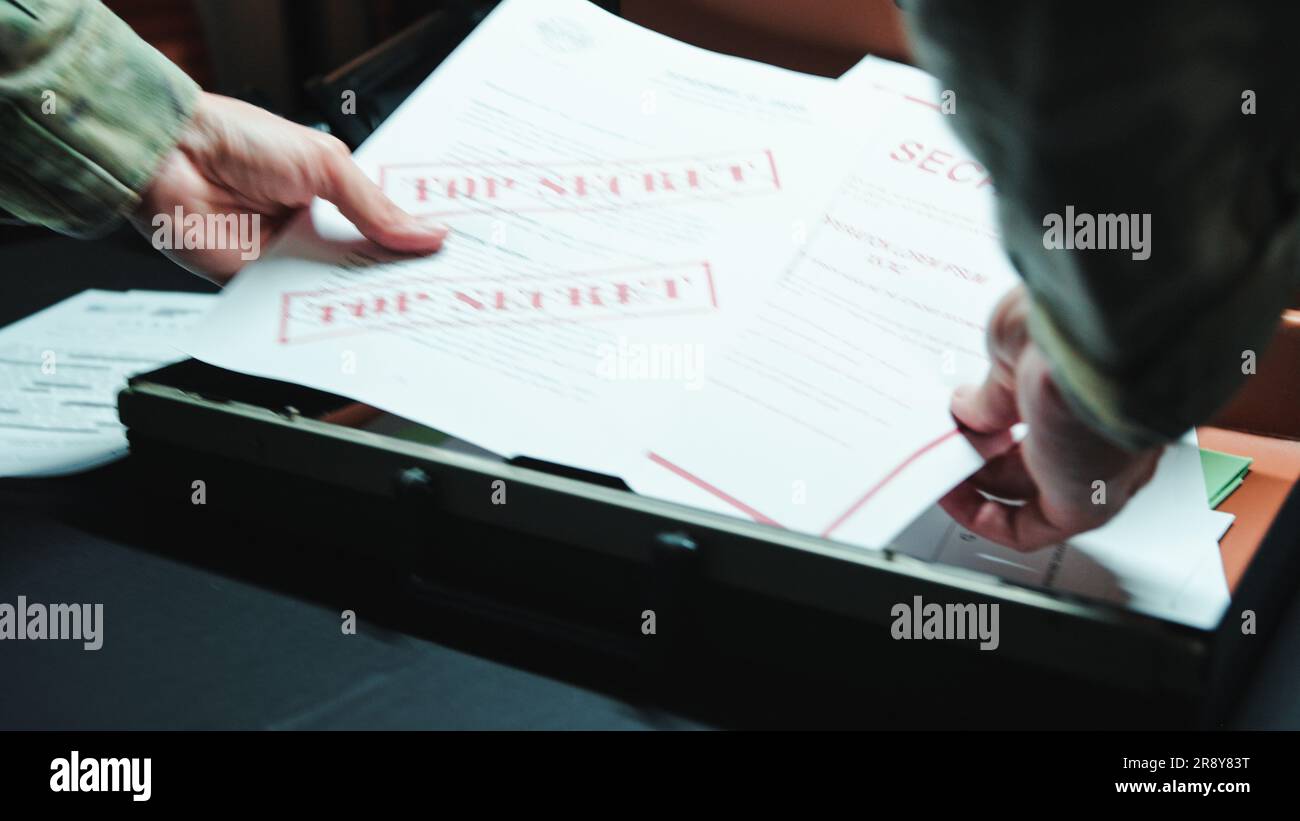 Opening Suitcase With Top Secret Papers Stock Photo - Alamy