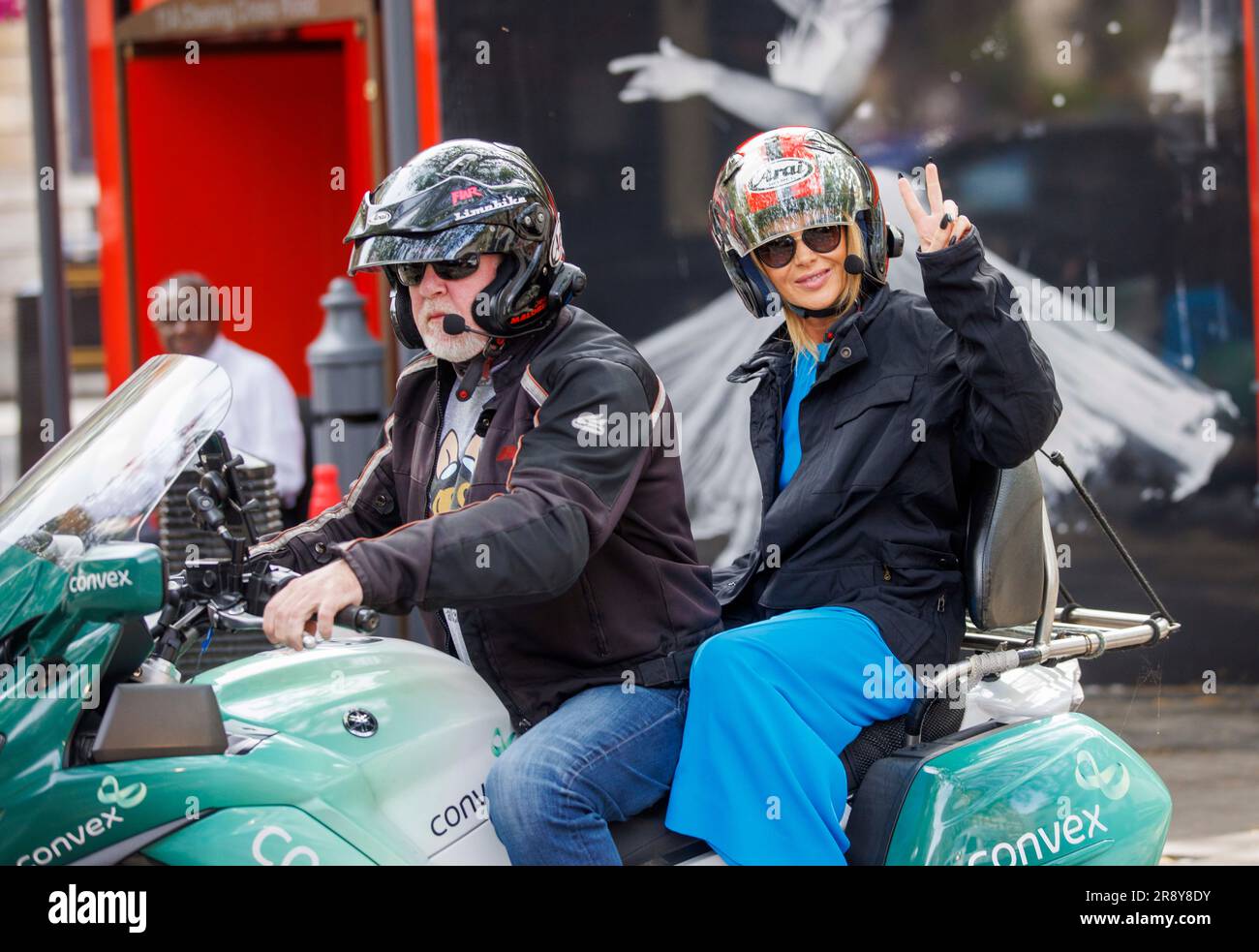 London, UK. 23rd June, 2023. Amanda Holden gets onto a Taxi Bike after ...
