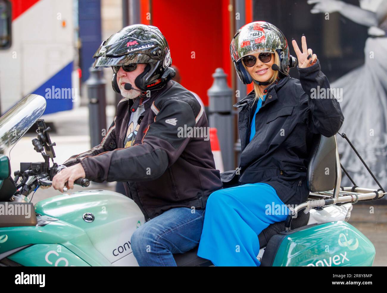 London, UK. 23rd June, 2023. Amanda Holden gets onto a Taxi Bike after ...
