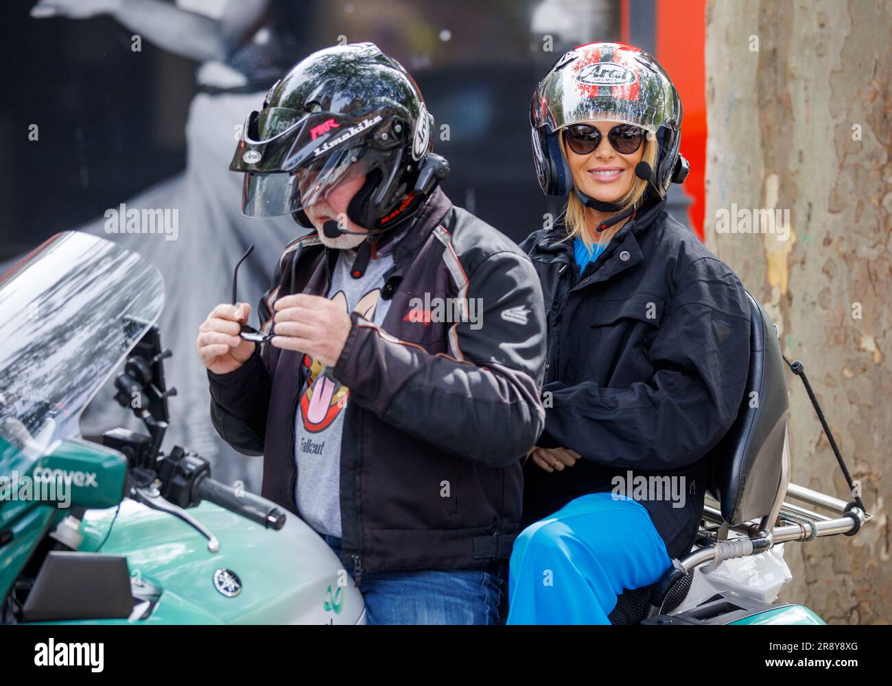London, UK. 23rd June, 2023. Amanda Holden gets onto a Taxi Bike after ...