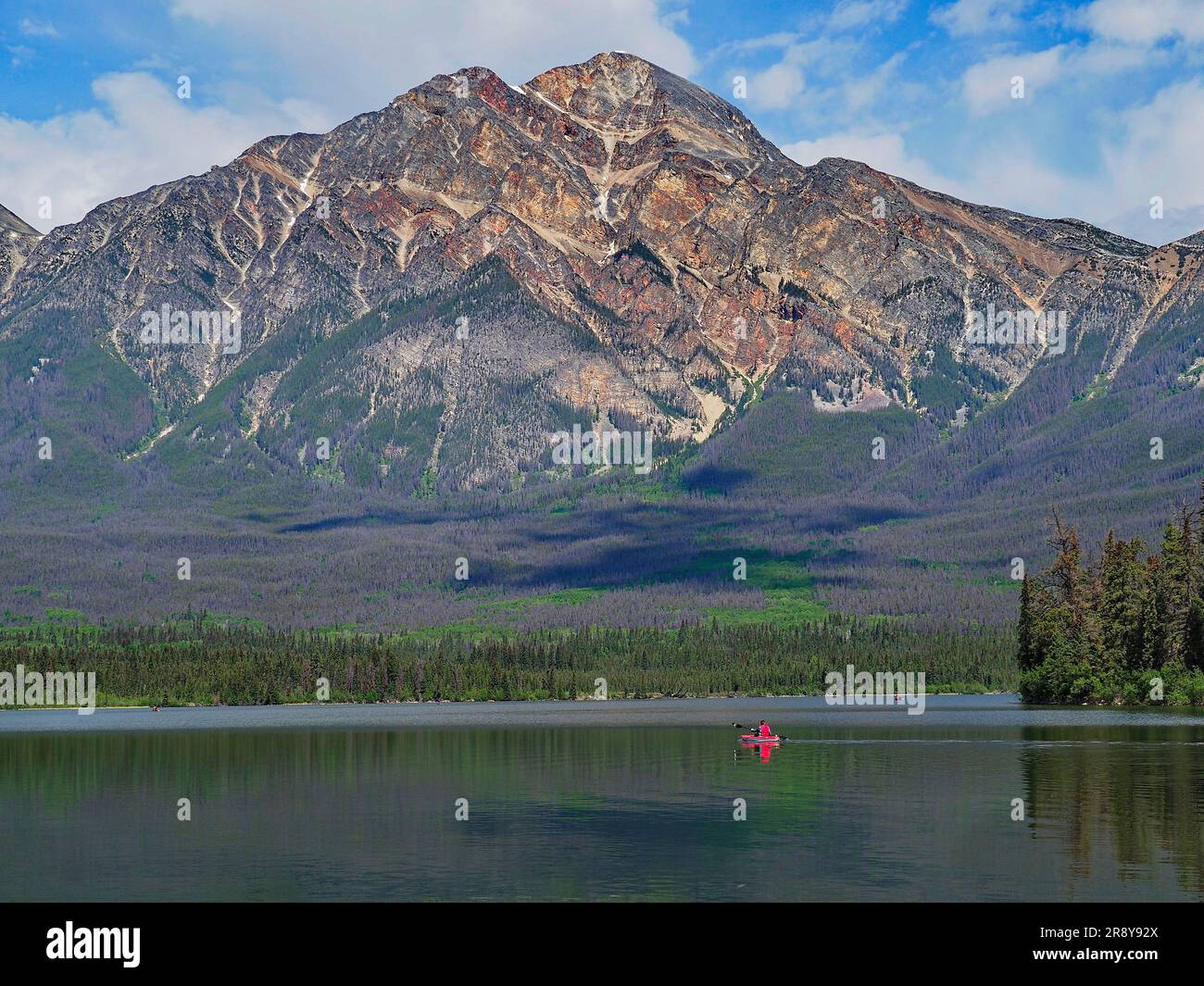 Pyramid mountain and its reflection on the lake in the Rocky Mountains ...