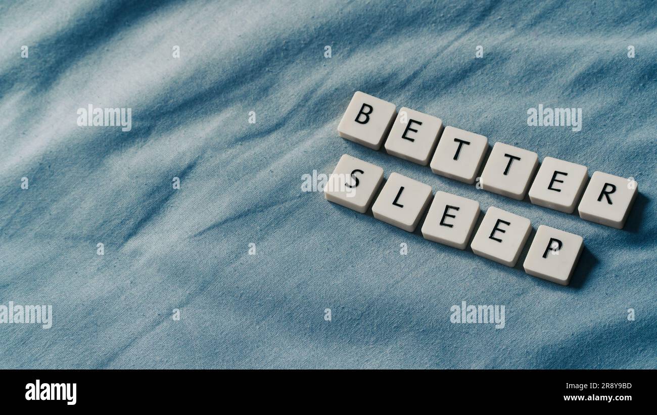 Sleep concept. Better sleep words on bed. Sleep health concept. High ...