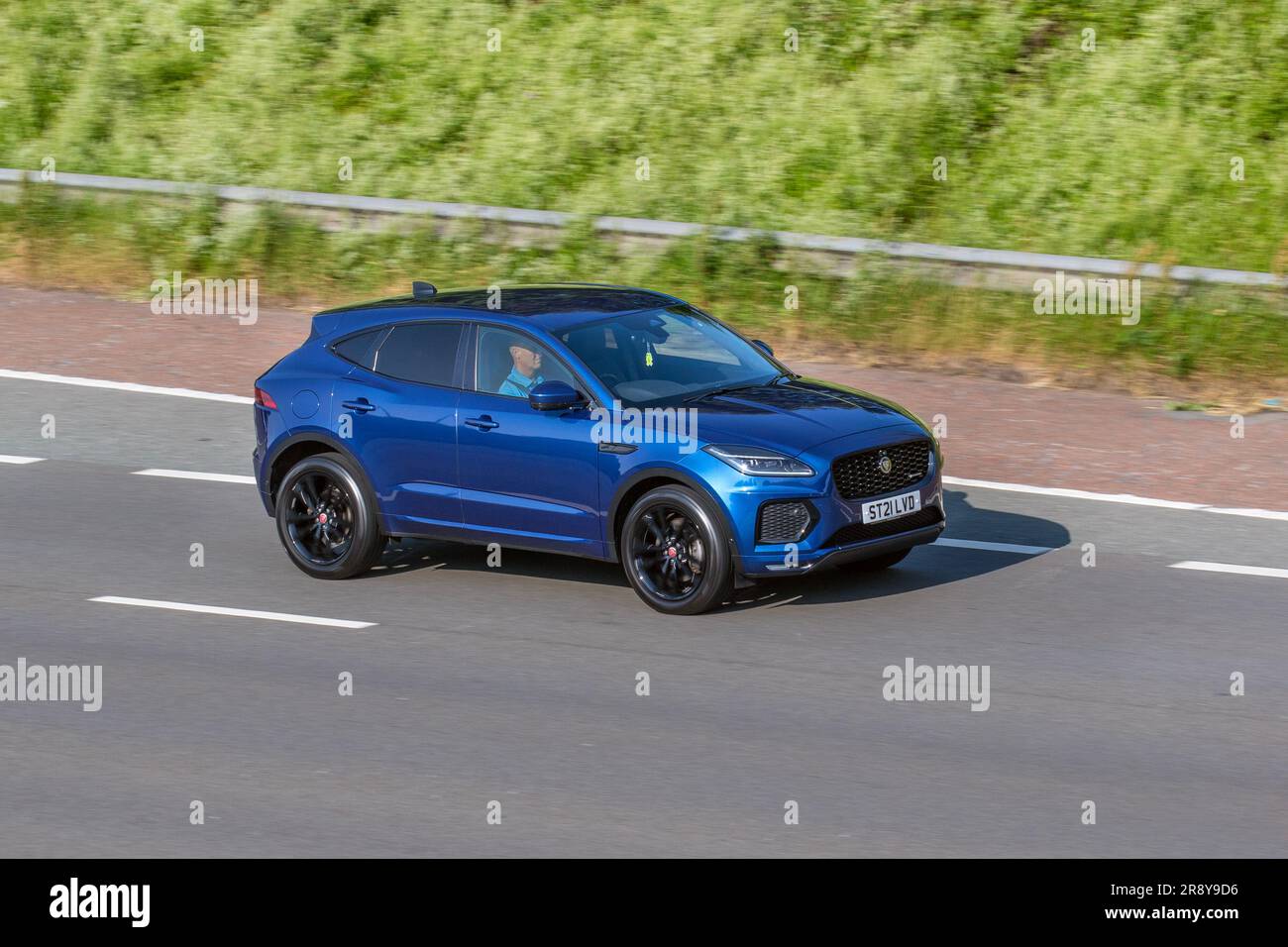 2021 blue Jaguar E-Pace R-Dynam SE D Mhev; travelling at speed on the ...