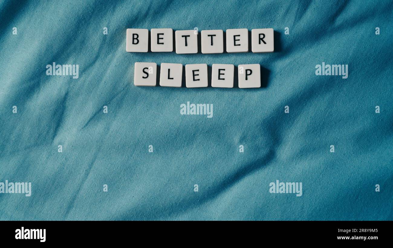 Sleep concept. Better sleep words on bed. Sleep health concept. High ...