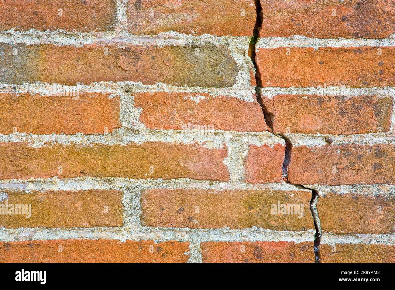 Old wall built with bricks cracked and damaged due to structural ...