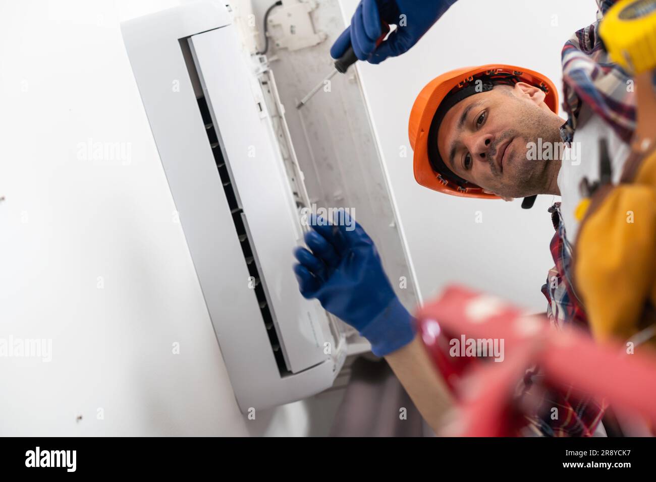 Professional technician maintaining modern air hi-res stock photography ...