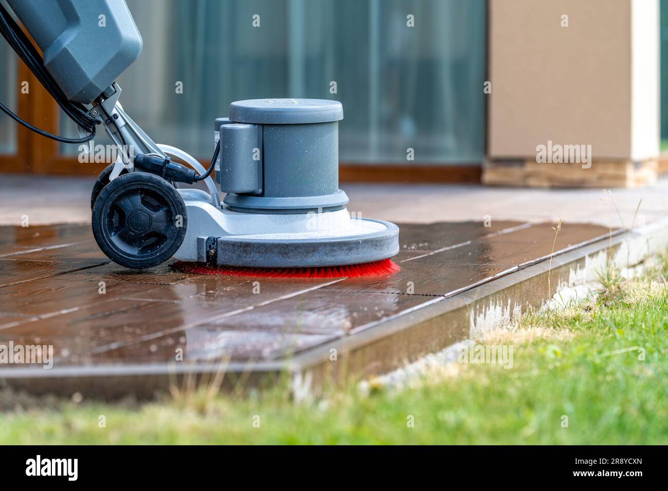 manual cleaning of concrete and stone terraces of the house with a ...