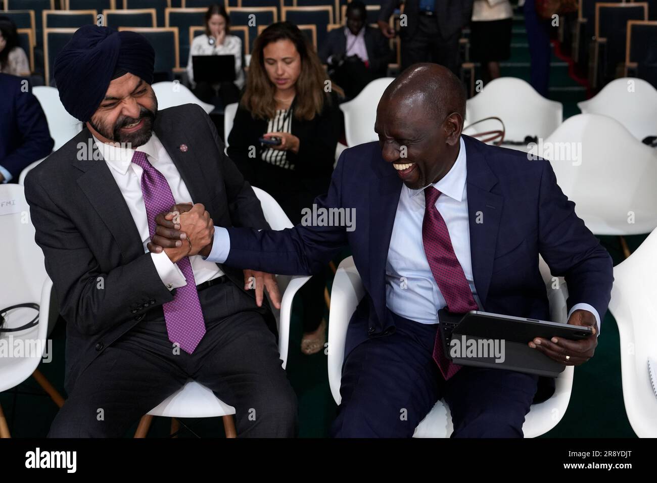 William Ruto, President of Kenya, right, shares a laugh with World Bank ...