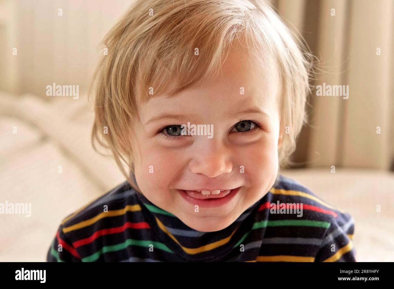 One little baby girl happy expression closeup face. Authentic real life ...