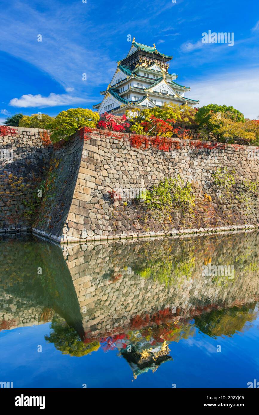 Osaka Castle tower with inner moat and autumn leaves Stock Photo - Alamy