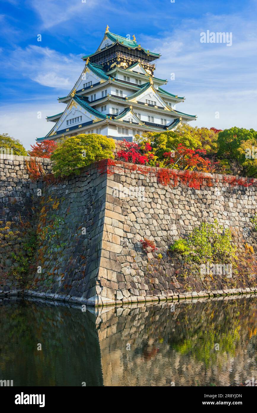 Osaka Castle tower with inner moat and autumn leaves Stock Photo - Alamy