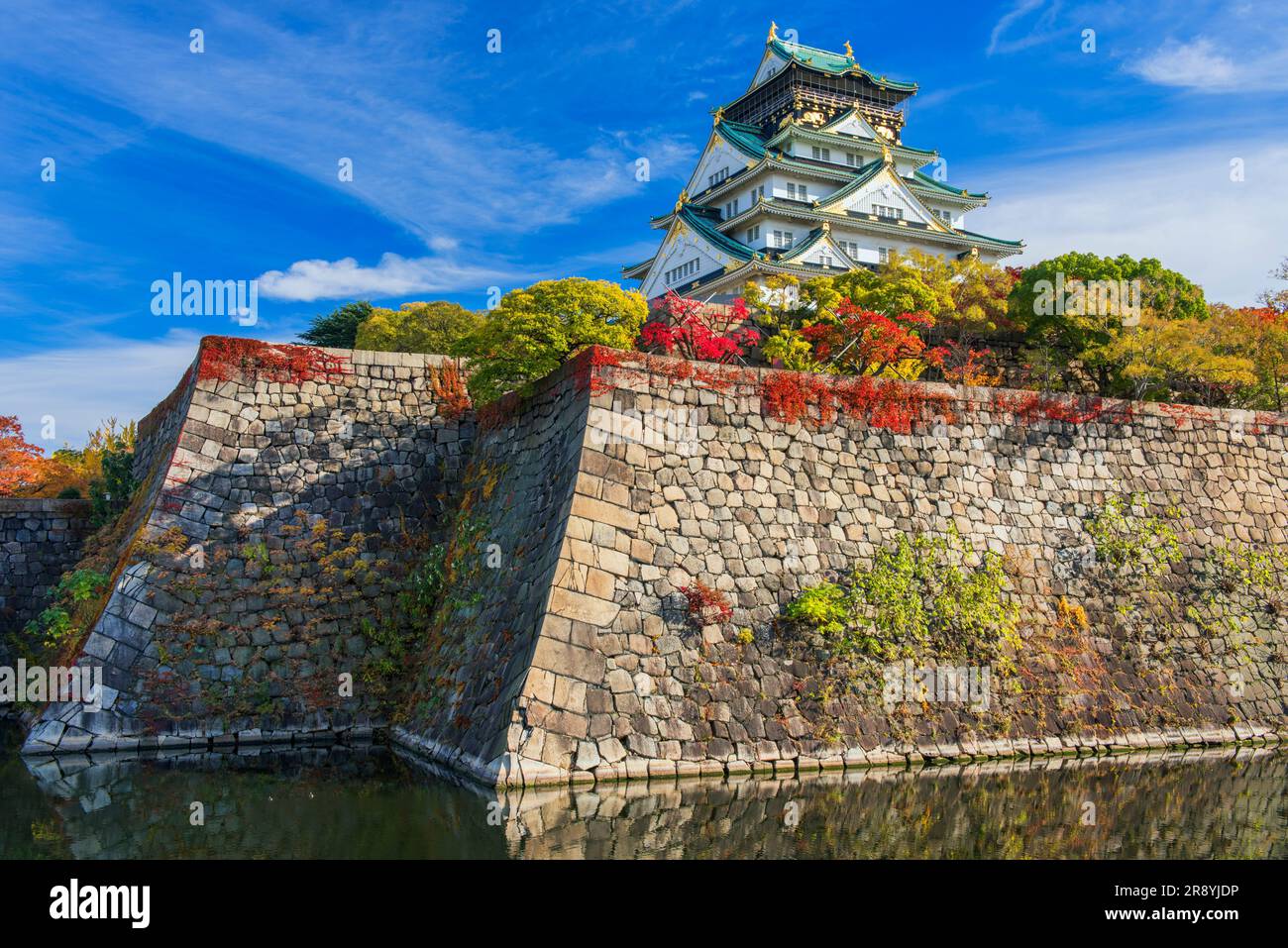 Osaka Castle tower with inner moat and autumn leaves Stock Photo - Alamy