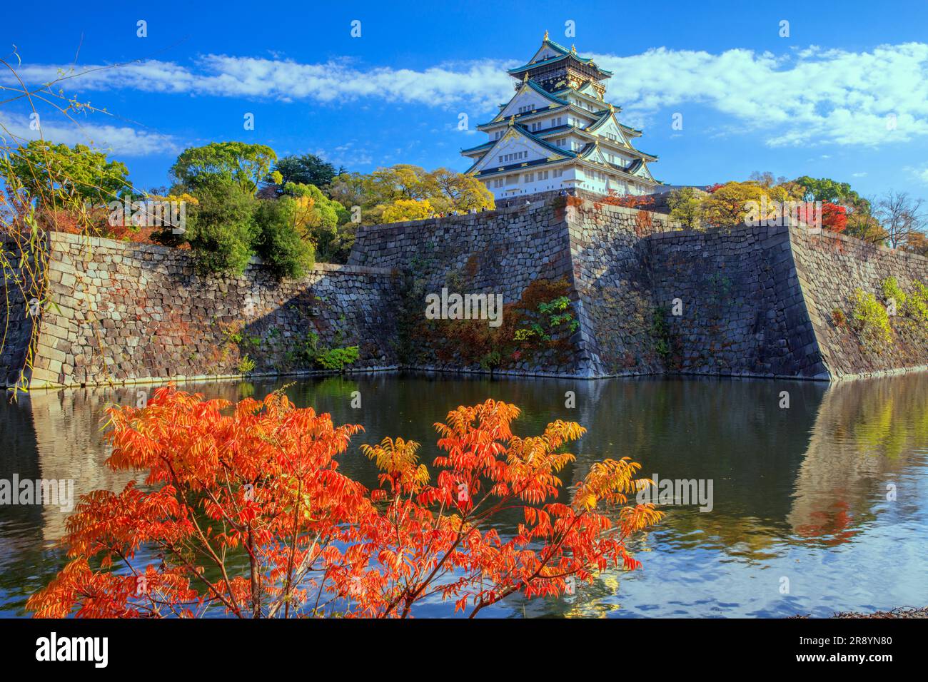 Osaka Castle tower with inner moat and autumn leaves Stock Photo - Alamy