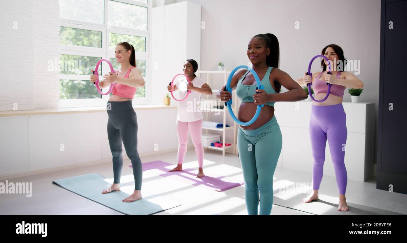 Training With Pilates Ring In Gym. Prenatal Pregnant Group Fitness ...