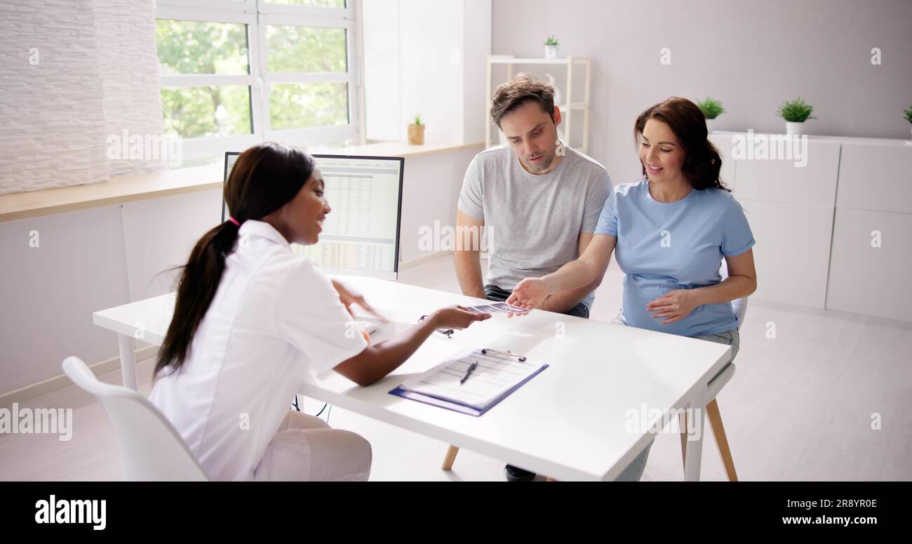 Female Doctor Explaining Ultrasound Scan To Woman In Hospital Stock ...