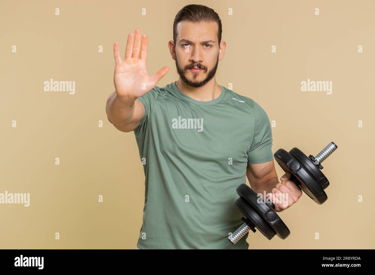 Stop. Athlete sportive man say no hold hand palm in stop gesture ...