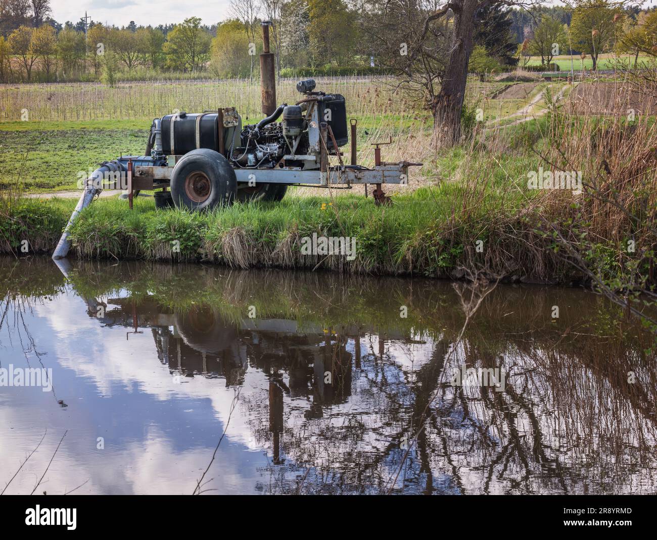 Vintage rusty water pump at a river Stock Photo - Alamy
